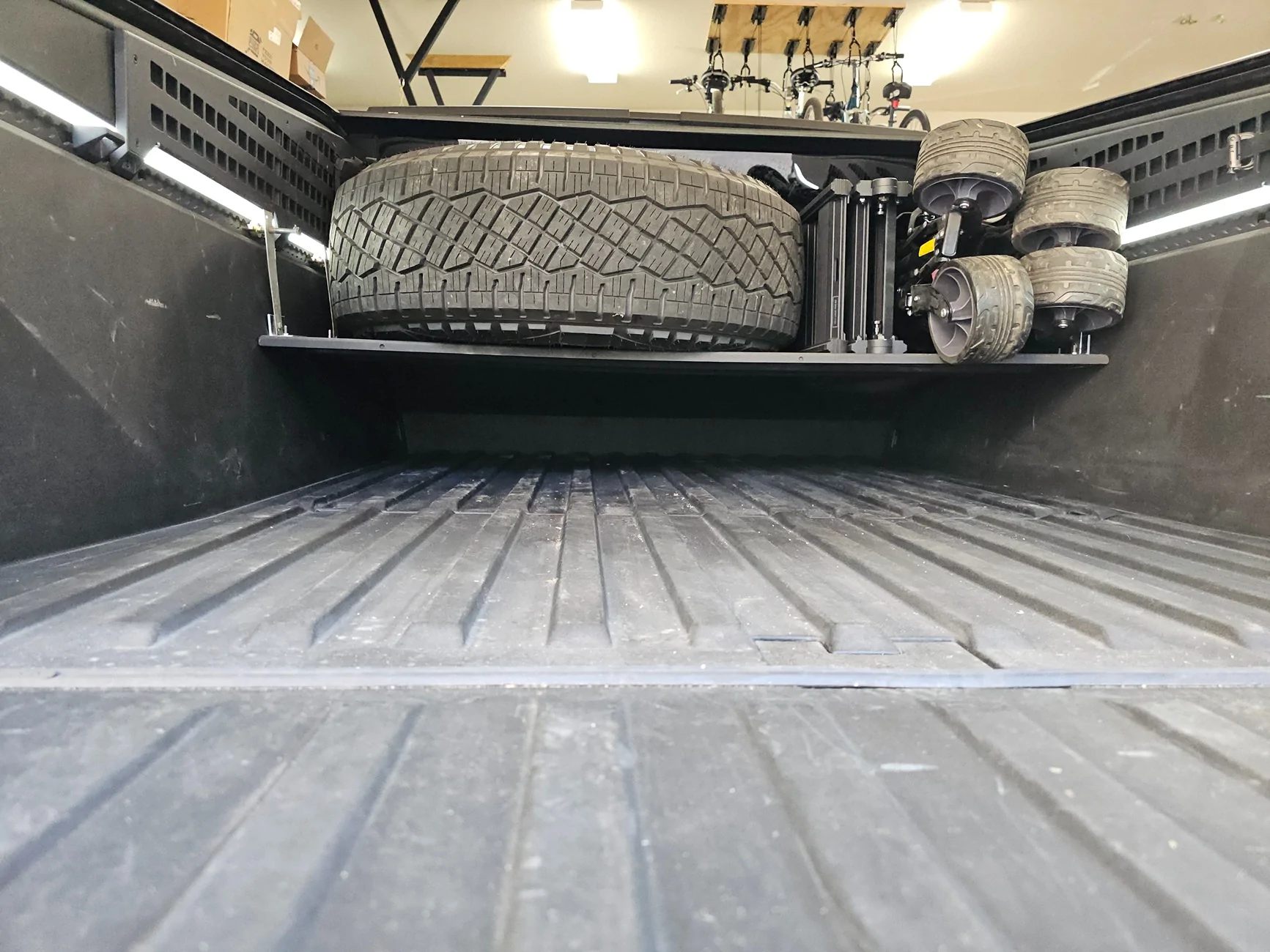 Spare tire mounting shelf option for bed vault (inexpensive but useful ...