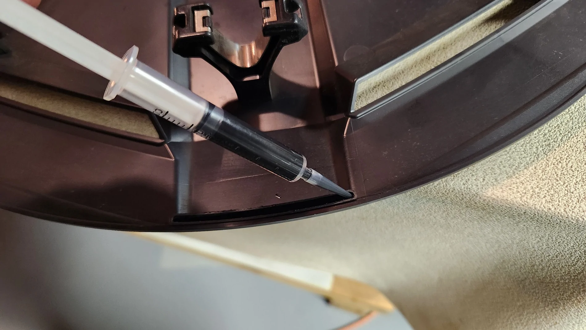 Prevent wheel abrasion from core wheel covers by using liquid rubber padding or wire harness ...