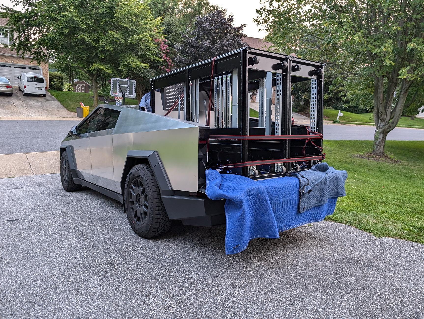 Cybertruck doing Cyber stuff -- hauling two full-sized server racks ...