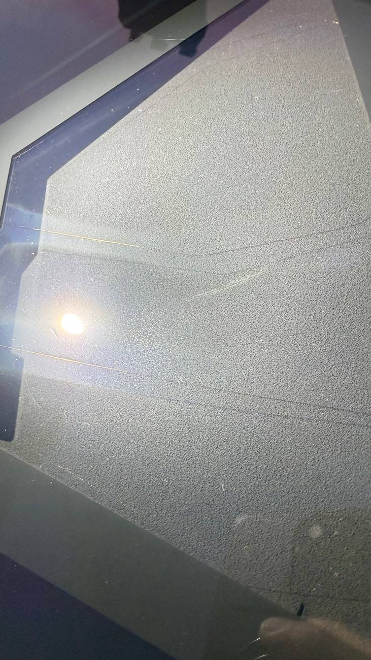 Glass (just cleaned at service) in front of camera has permanent haze ...