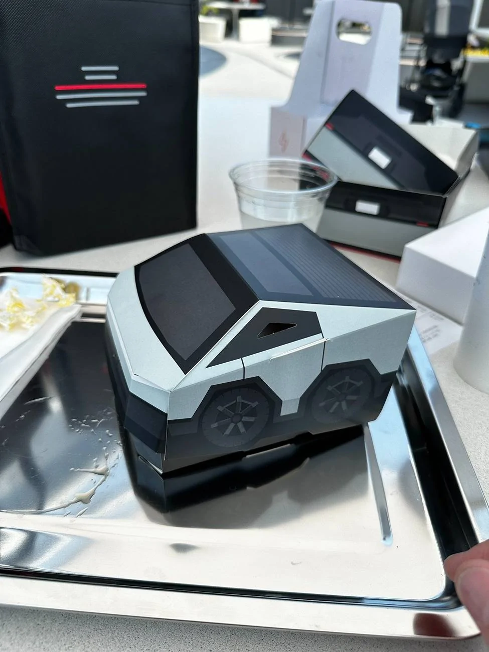 Tesla Diner: Cybertruck burger box, Optimus serves popcorn & more ...